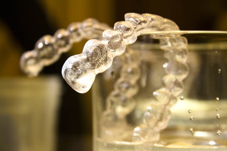 7 Tips On How to Clean Invisalign Trays and Retainers | Aura Orthodontics